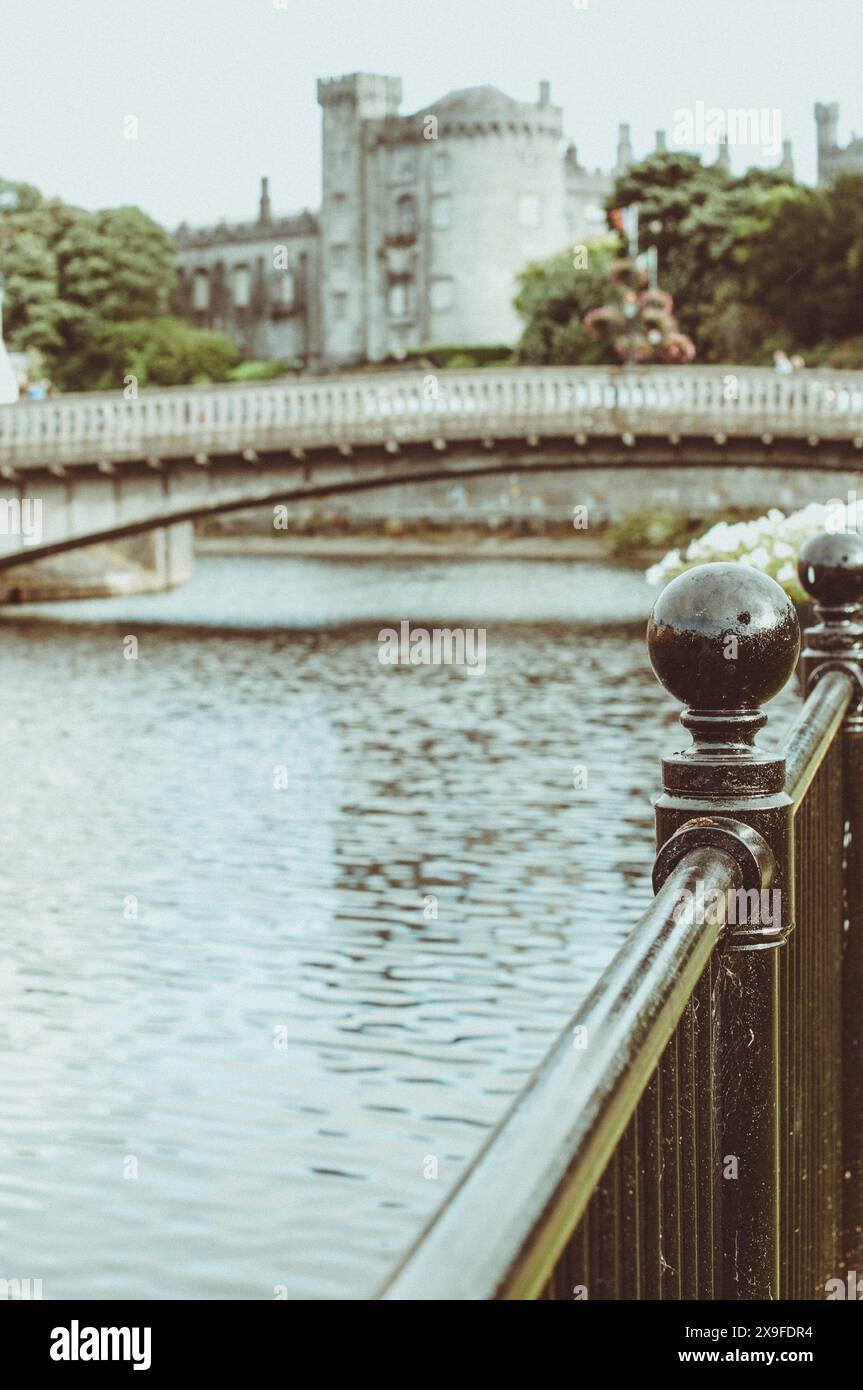 Bridge over a river Nore with Kilkenny Castle in the background ...