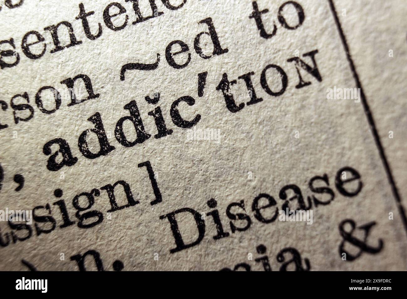Word addiction on dictionary page, macro close-up Stock Photo - Alamy