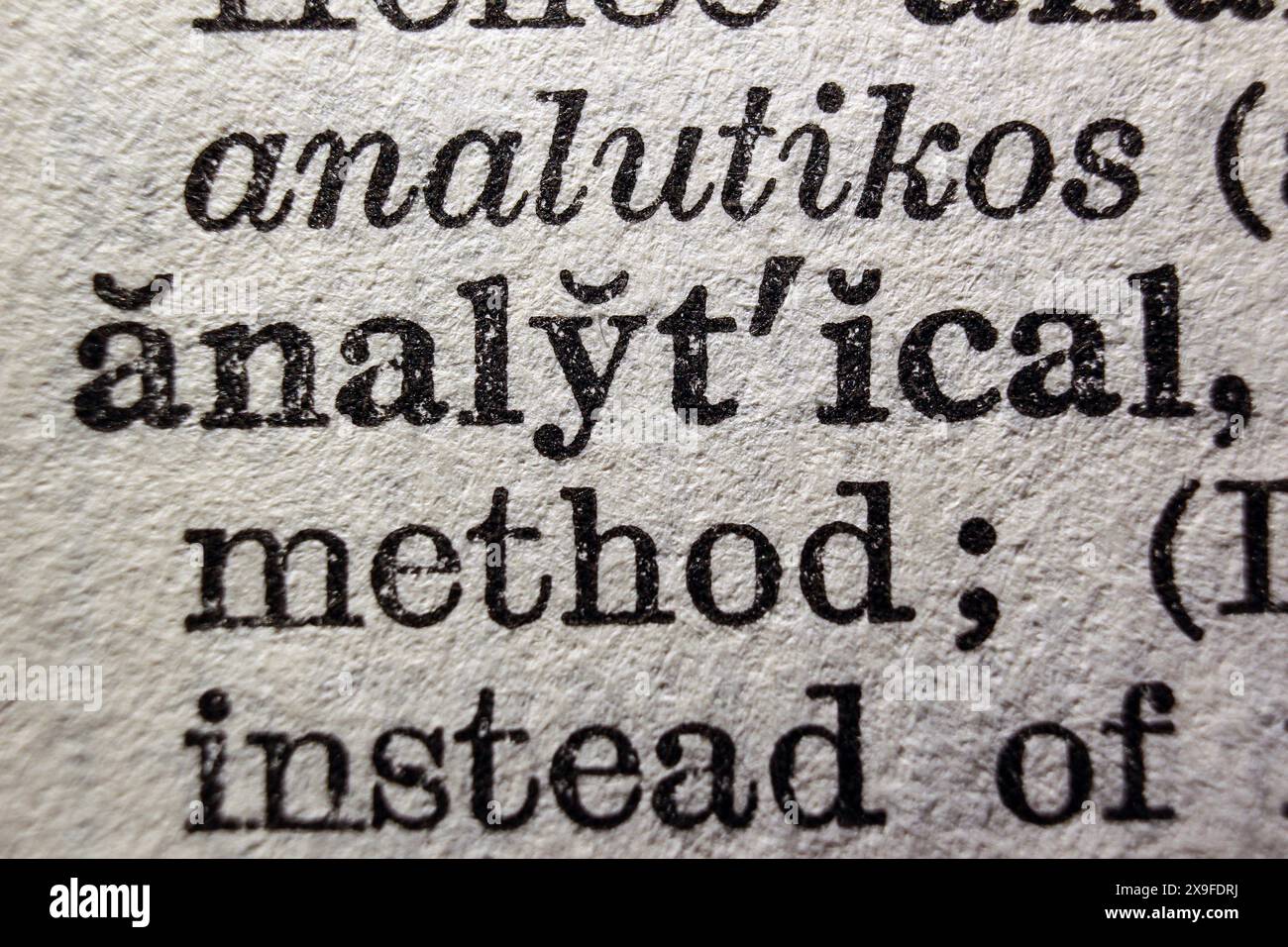 Word analytical on dictionary page, macro close-up Stock Photo - Alamy