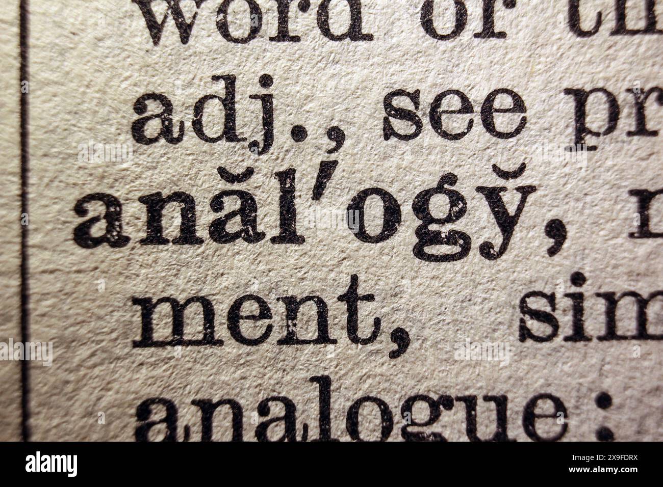 Word analogy on dictionary page, macro close-up Stock Photo - Alamy