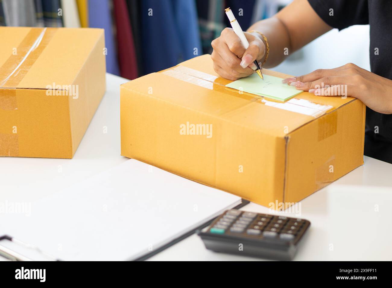 SME entrepreneurs prepare packages and verify customer information ...