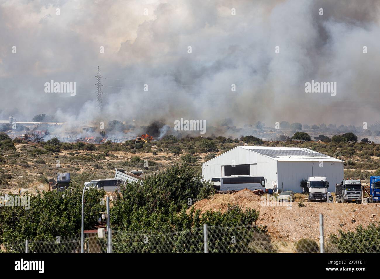Limassol, Cyprus. 31st May, 2024. Smoke is seen behind an industrial ...