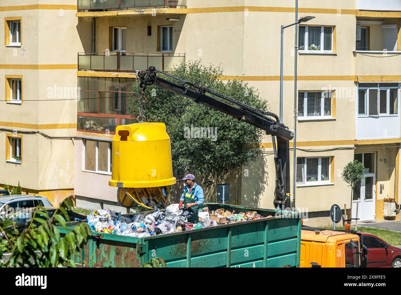 Sibiu City, Romania - 27 May 2024. Workers colect container with ...