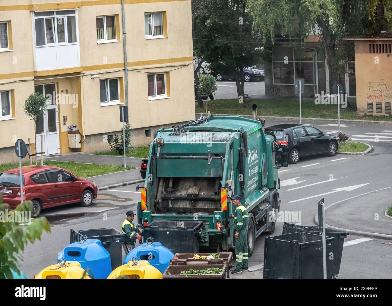 Sibiu City, Romania - 29 May 2024. Workers colect container with ...