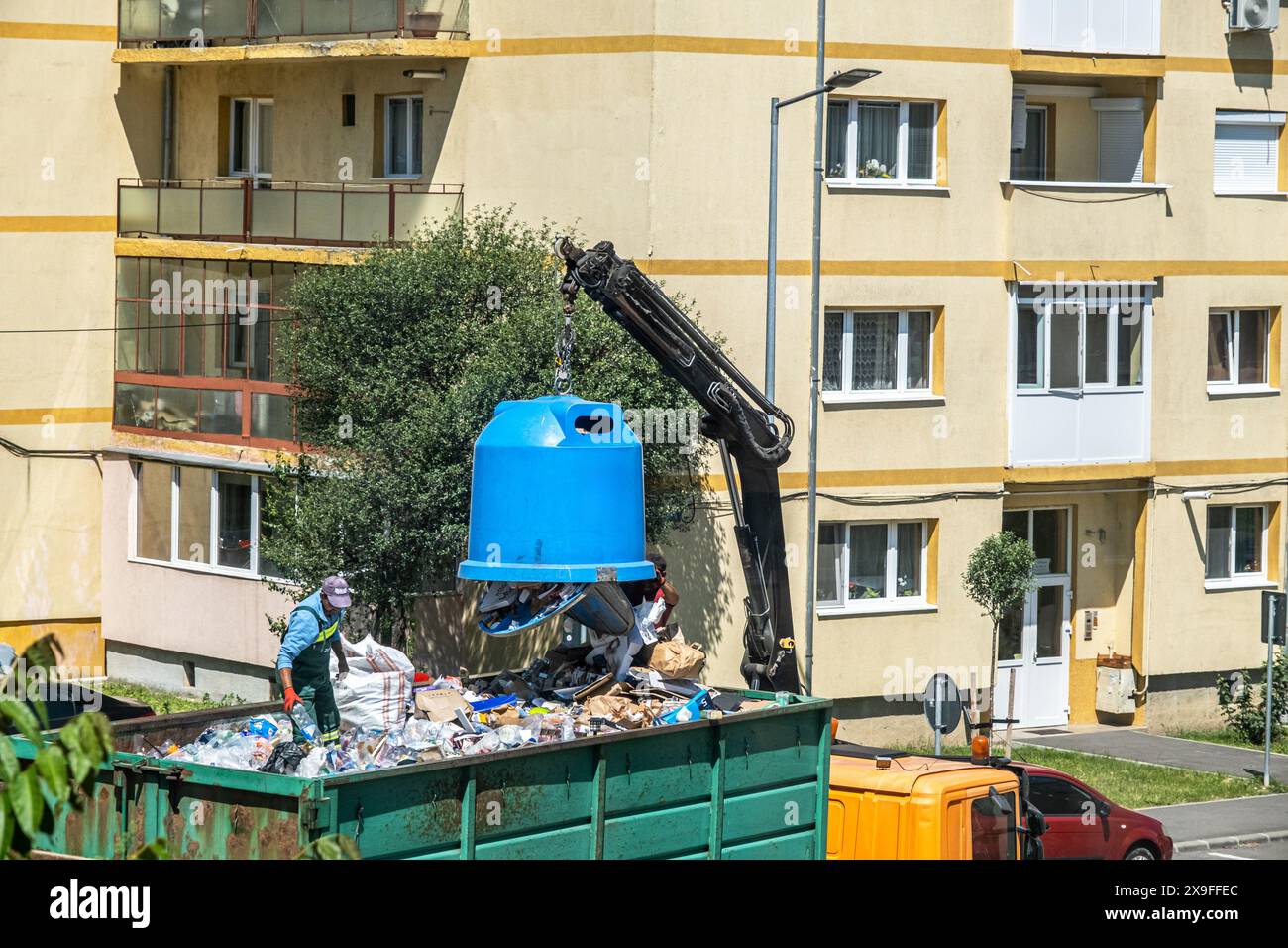 Sibiu City, Romania - 27 May 2024. Workers colect container with ...