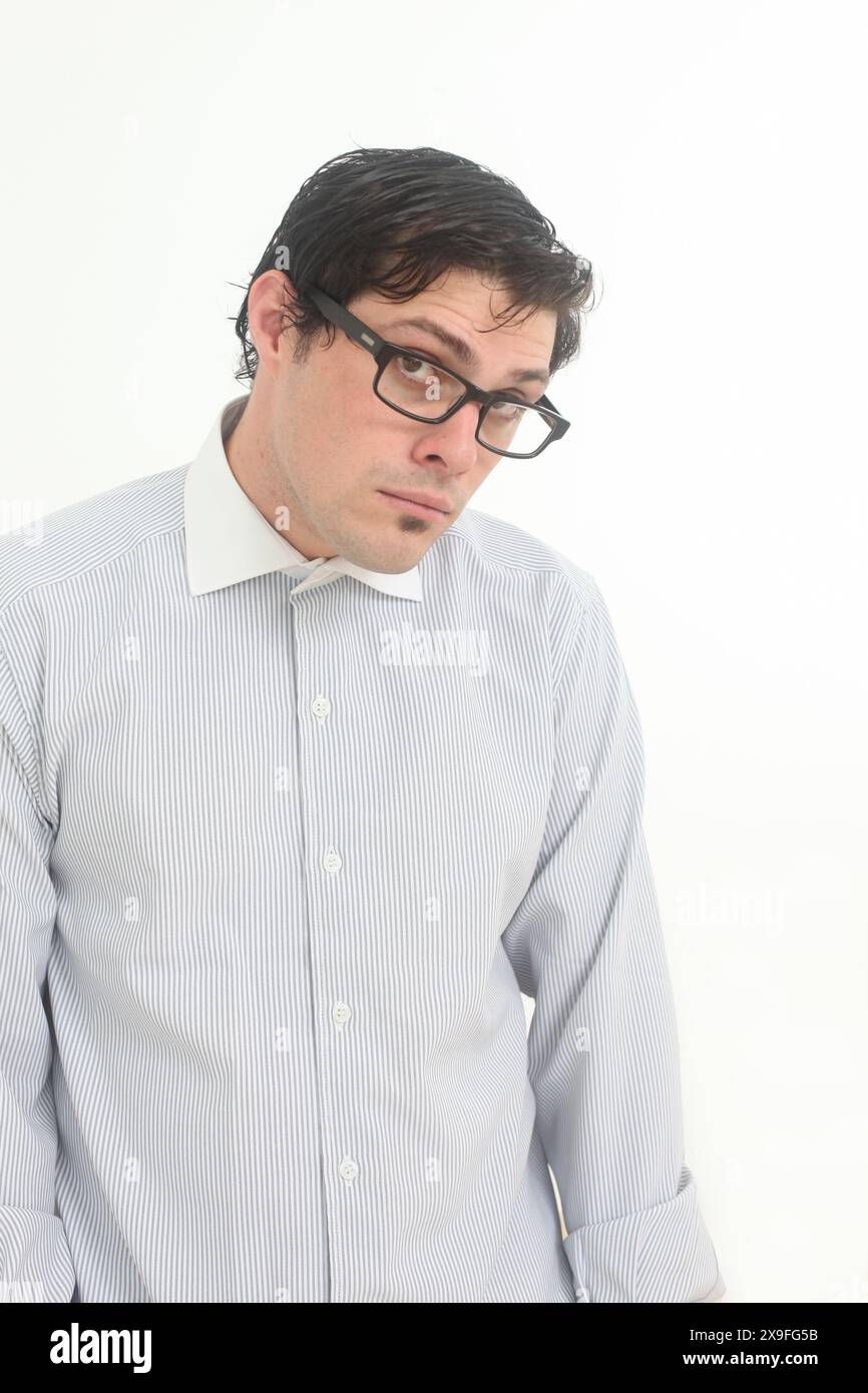 shy and insecure male nerd wearing glasses on white background Stock ...