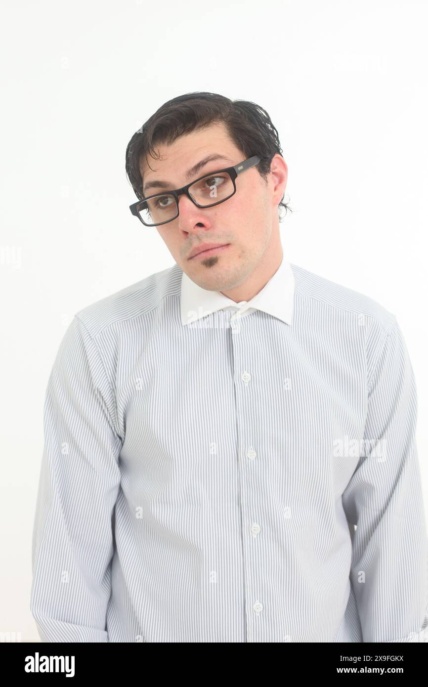 shy and insecure male nerd wearing glasses on white background Stock ...