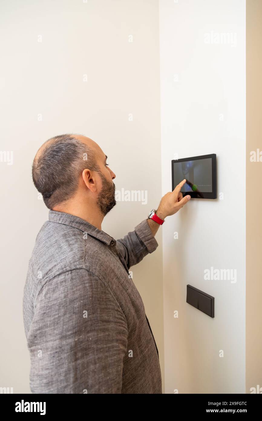 Touch screen interaction on the wall Stock Photo - Alamy