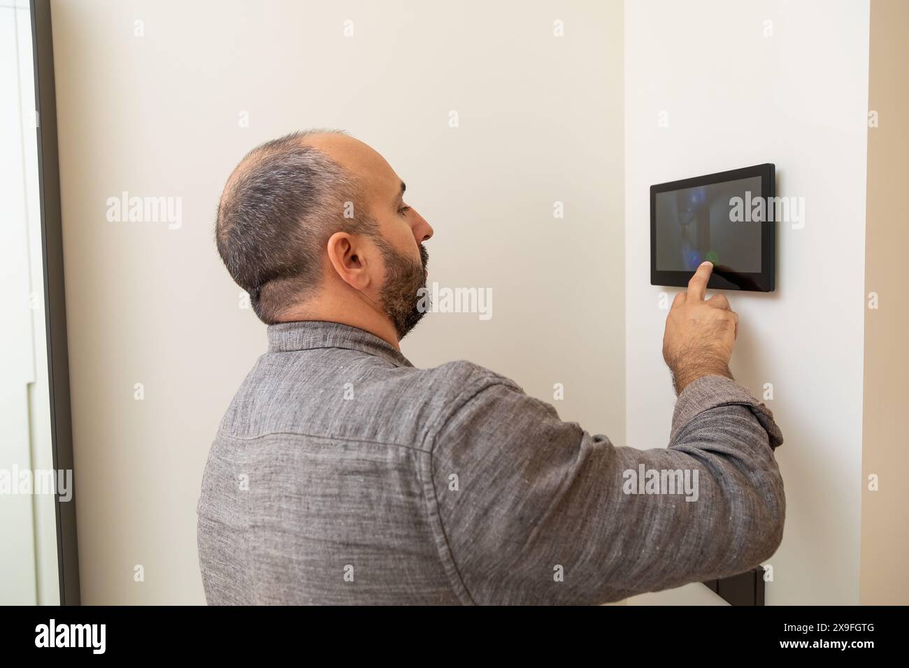 Touch screen interaction on the wall Stock Photo - Alamy