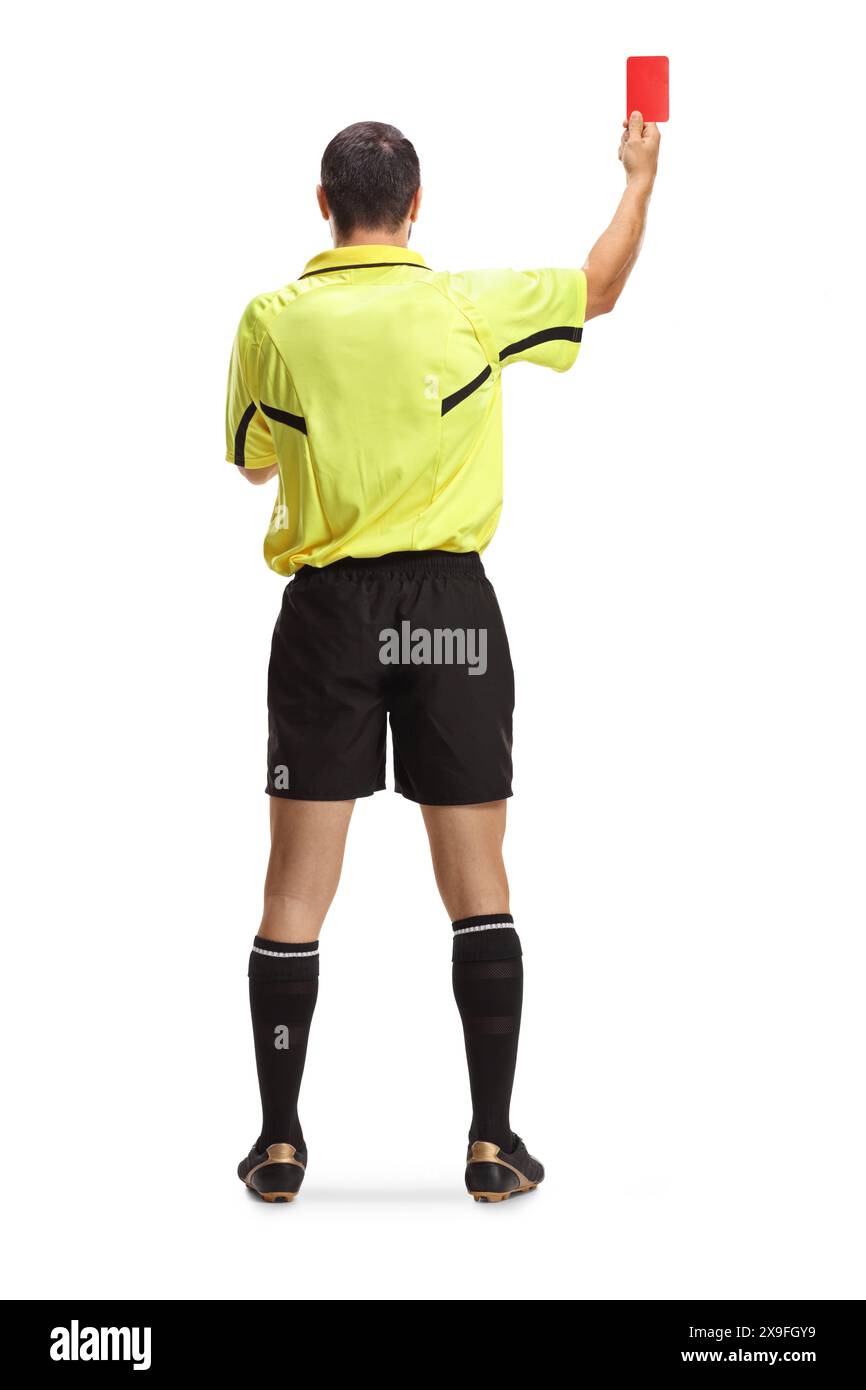 Rear view shot of a football referee showing a red card isolated on ...