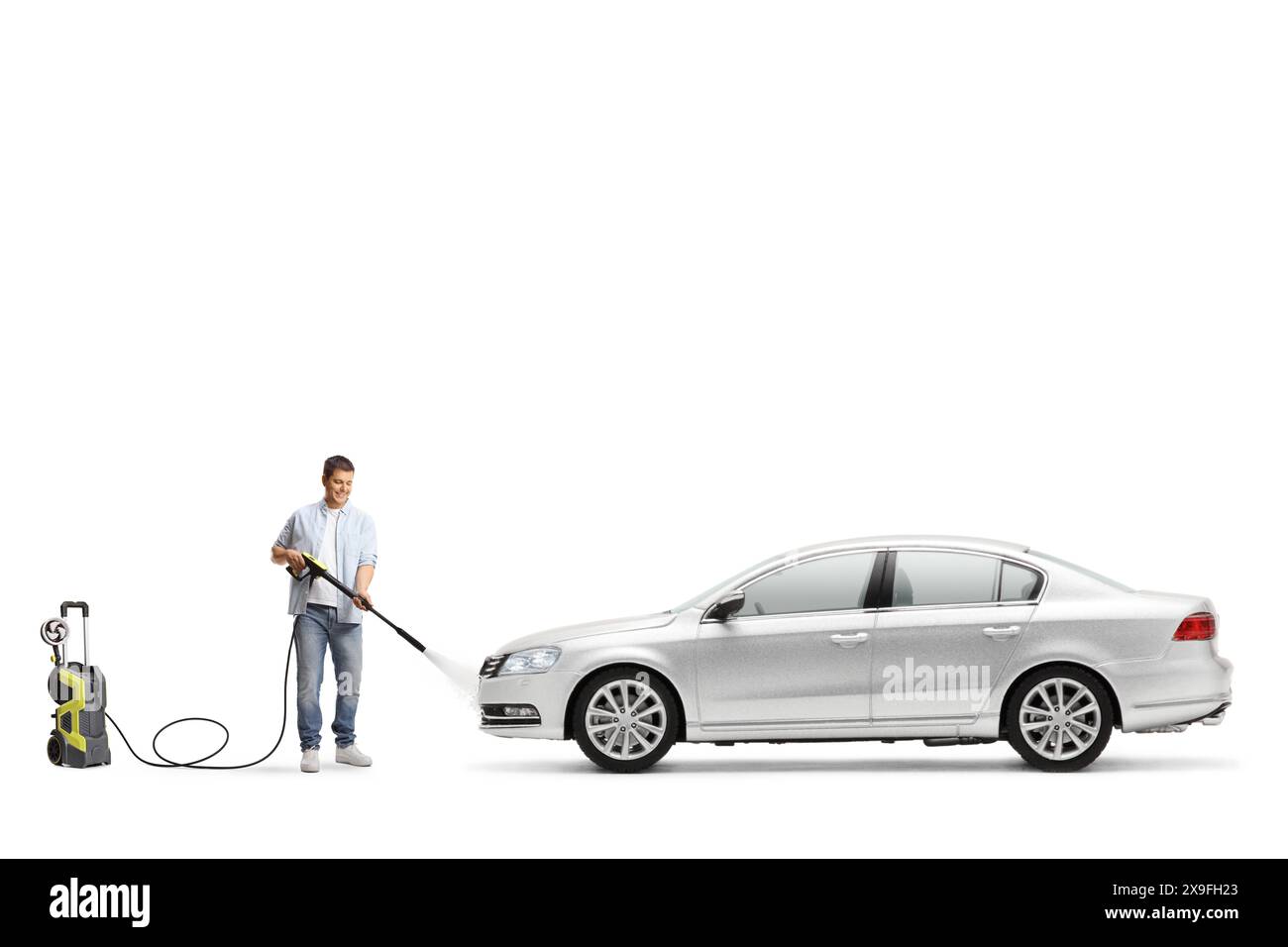 Man washing a car with a high pressure washer machine isolated on white ...