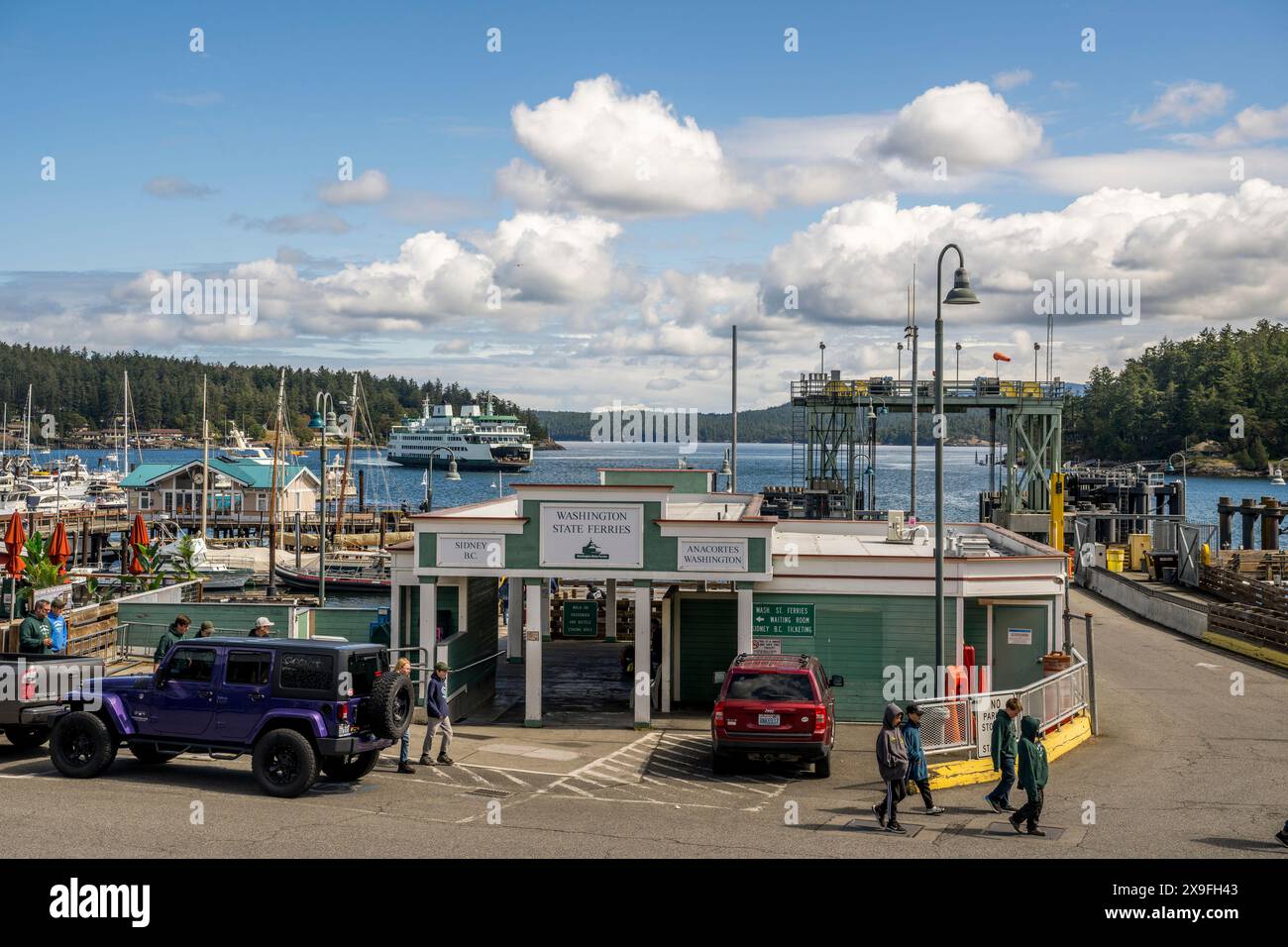 A Washington State Ferry is approaching Friday Harbor on San Juan ...