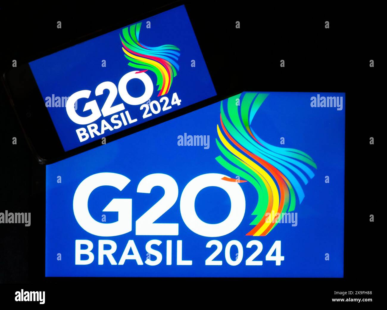 In this photo illustration, a 2024 G20 Rio de Janeiro summit logo seen displayed on a smartphone ...