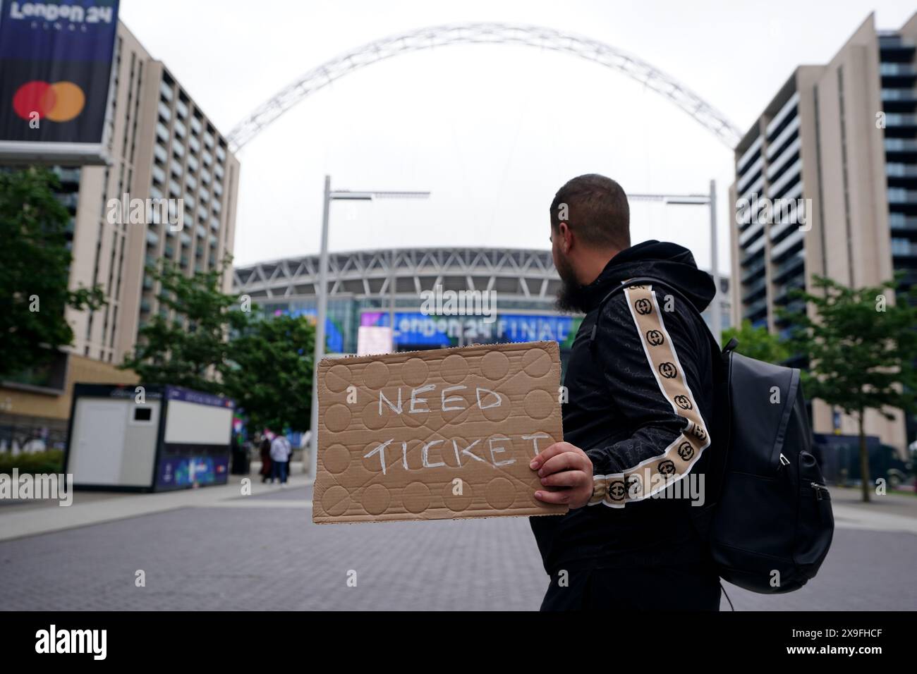 A ticket tout outside the stadium ahead of a training session at ...