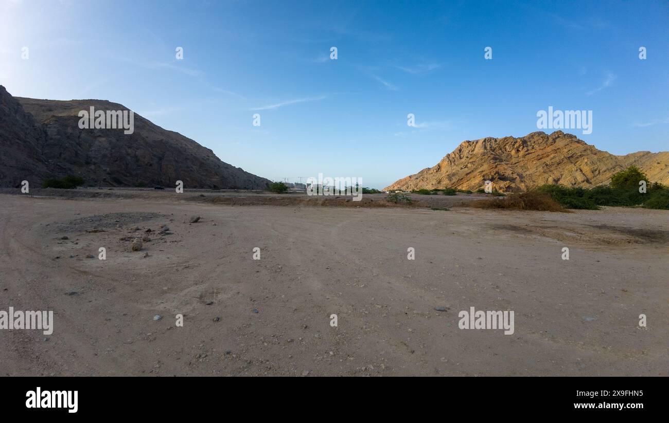 Photography of dried up riverbed with mud and tyre tracks and ...