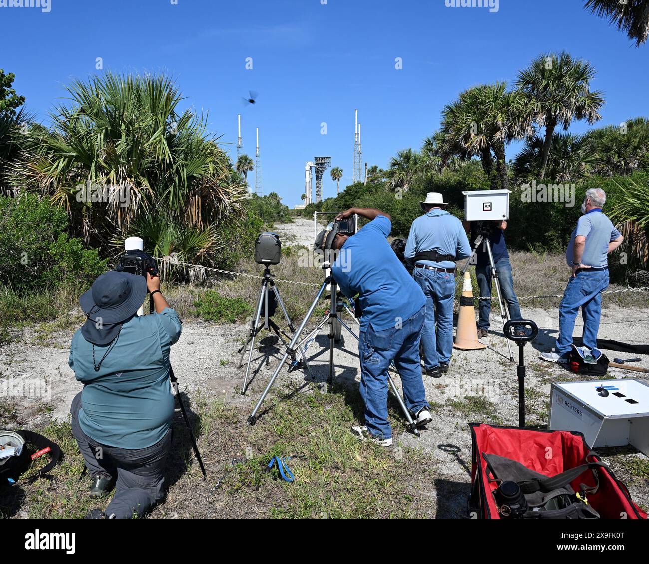 Media photographers set up remote cameras to document the launch of the ...