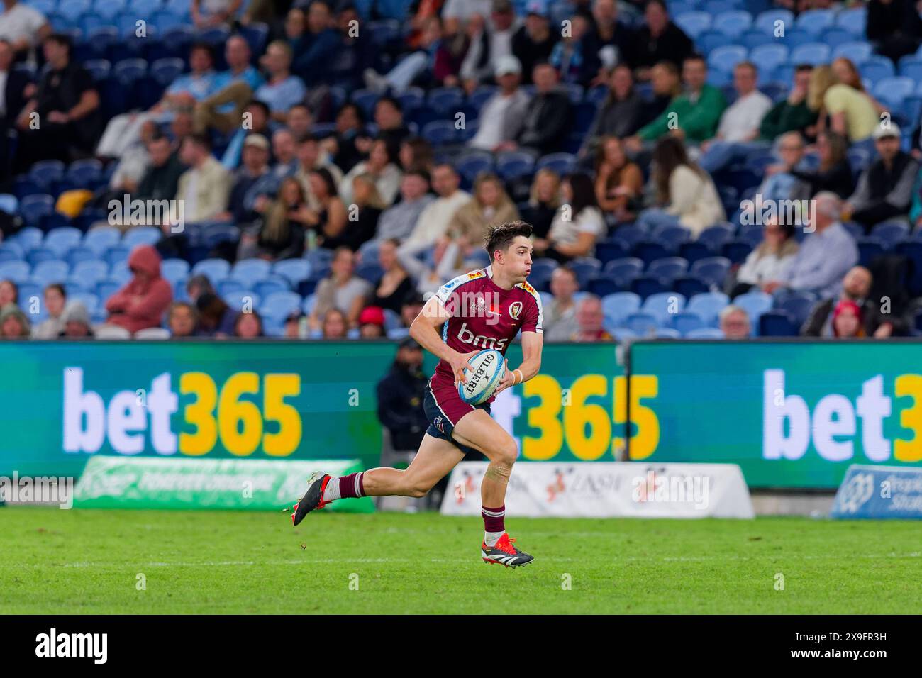 Sydney, Australia. 31st May, 2024. Jock Campbell of the Reds runs with ...