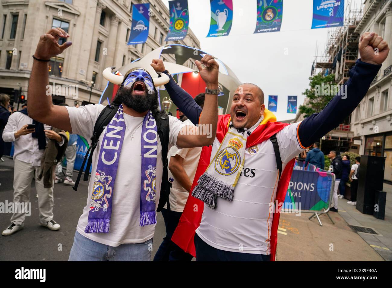 Real Madrid fans gather in a fan zone in Regent Street, in London ...