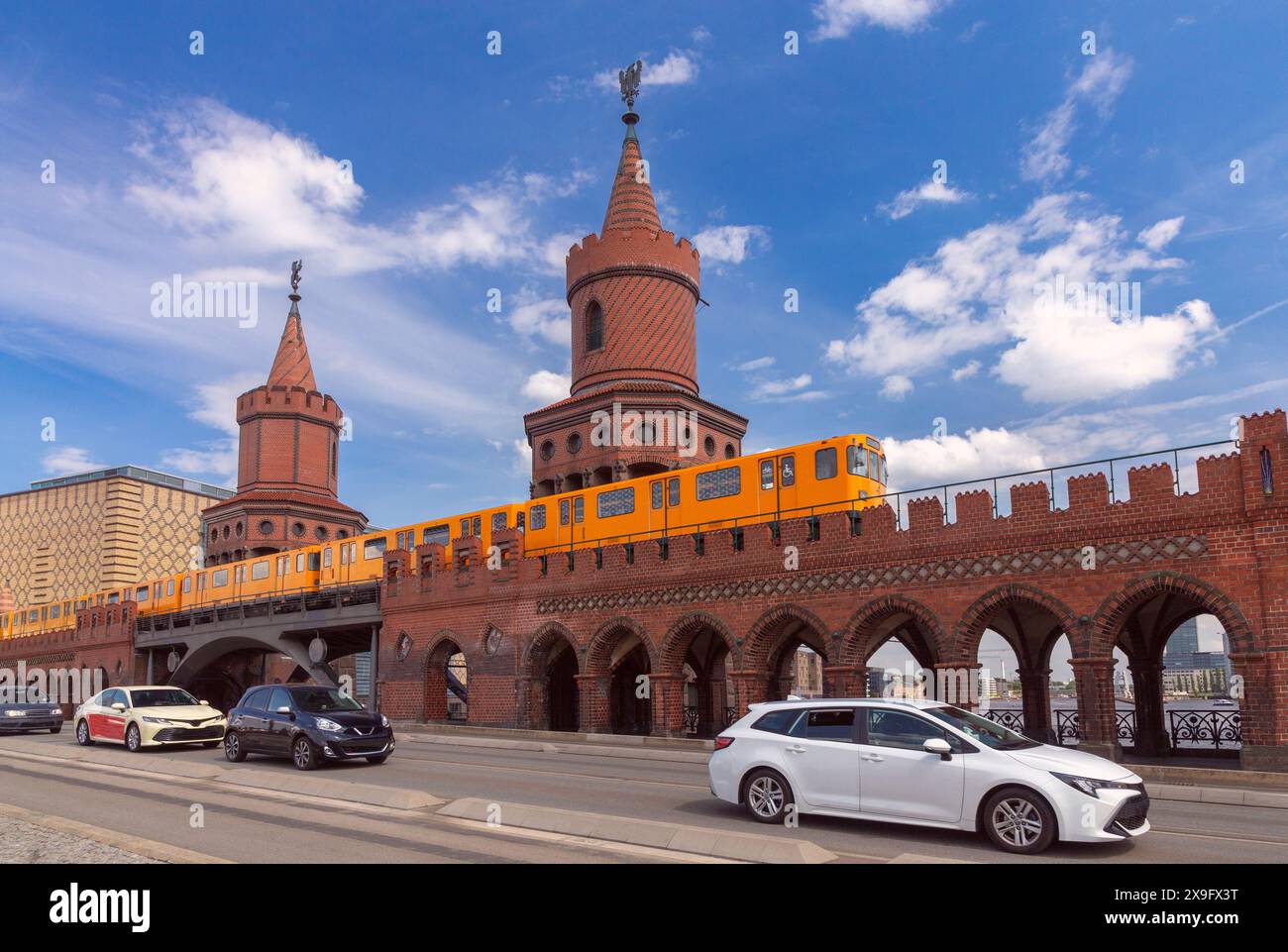 View of the yellow carriages of the popular Berlin metro on a sunny day ...