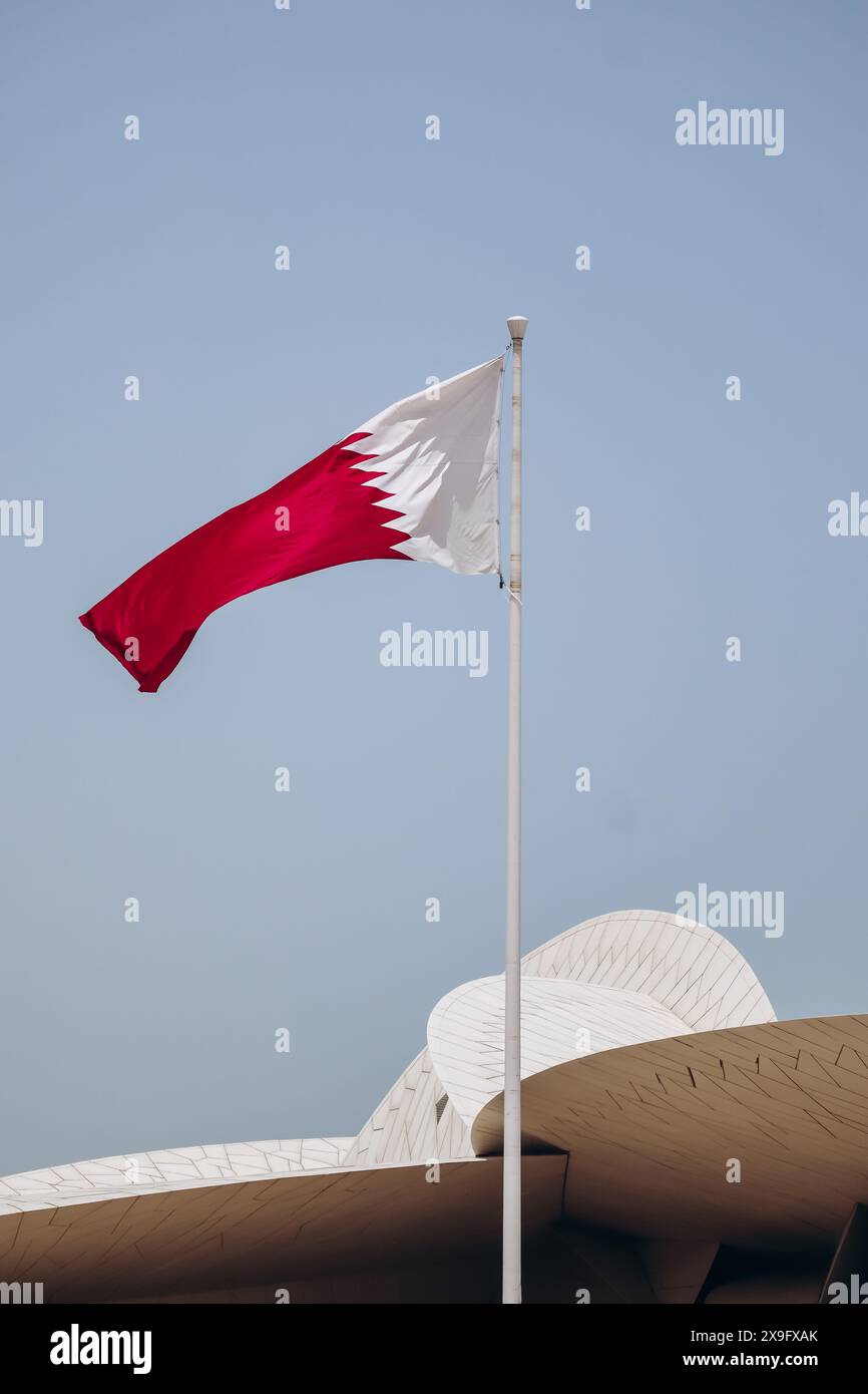 Waving flag of Qatar, in Doha Stock Photo - Alamy