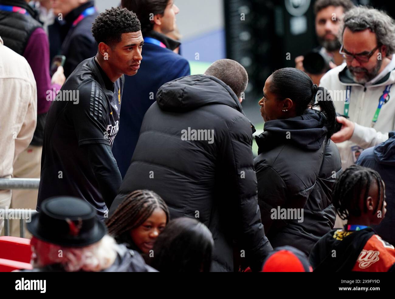 Real Madrid's Jude Bellingham speaks with his family following a ...