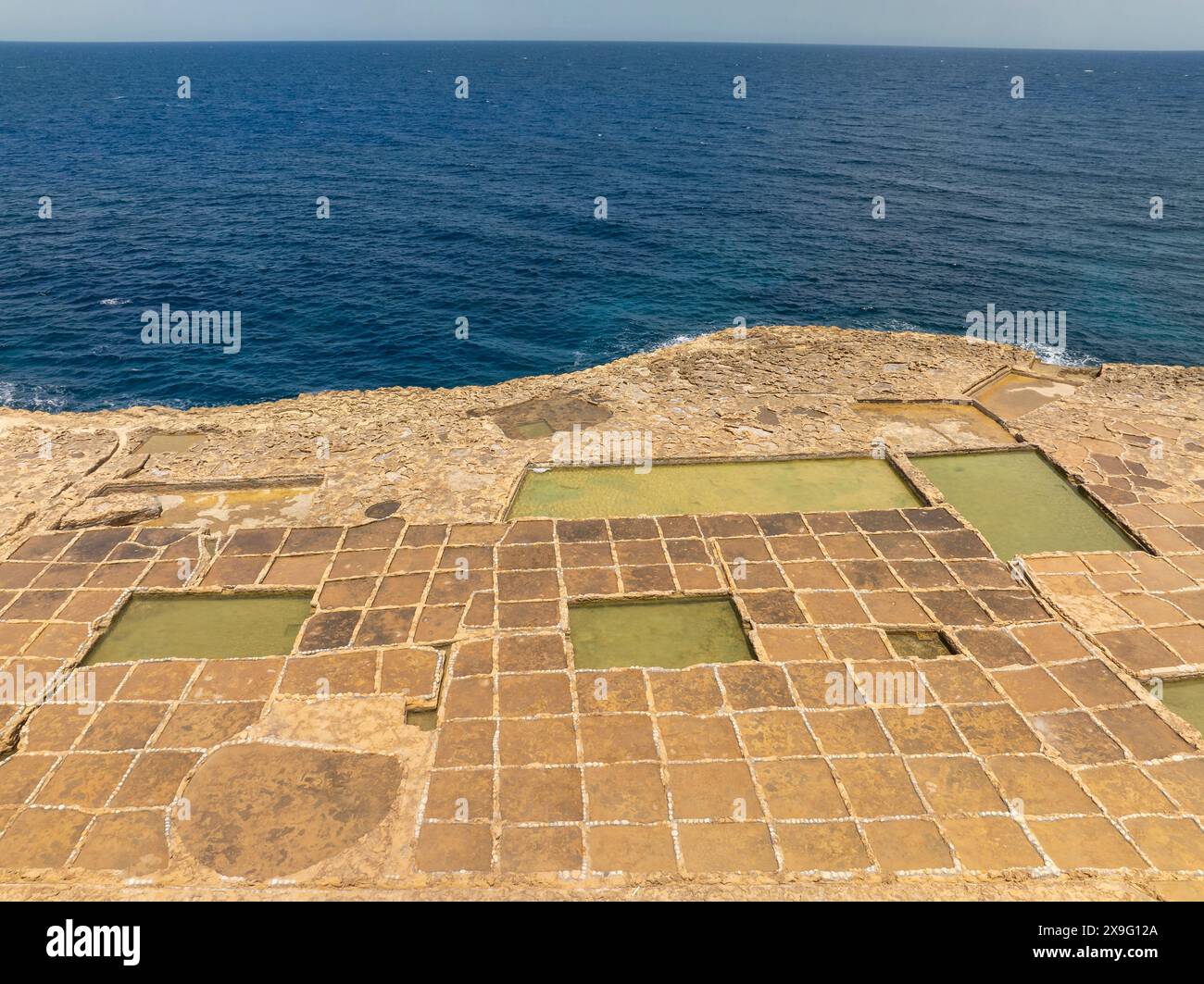 Famous touristic attraction in Gozo island the Salt Pans in Xwejni Bay ...