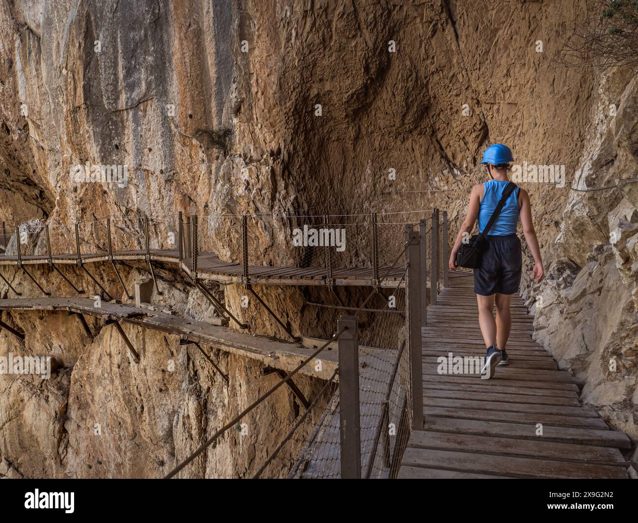 A young female woman girl tourist walking on the new walkway over the ...