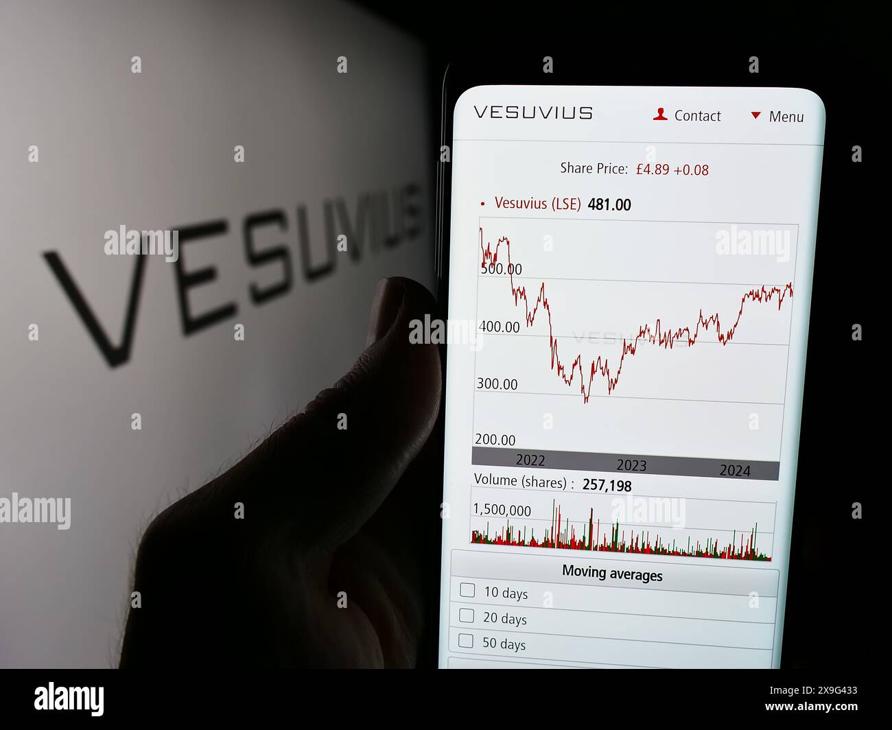 Person holding cellphone with website of British engineered ceramics ...
