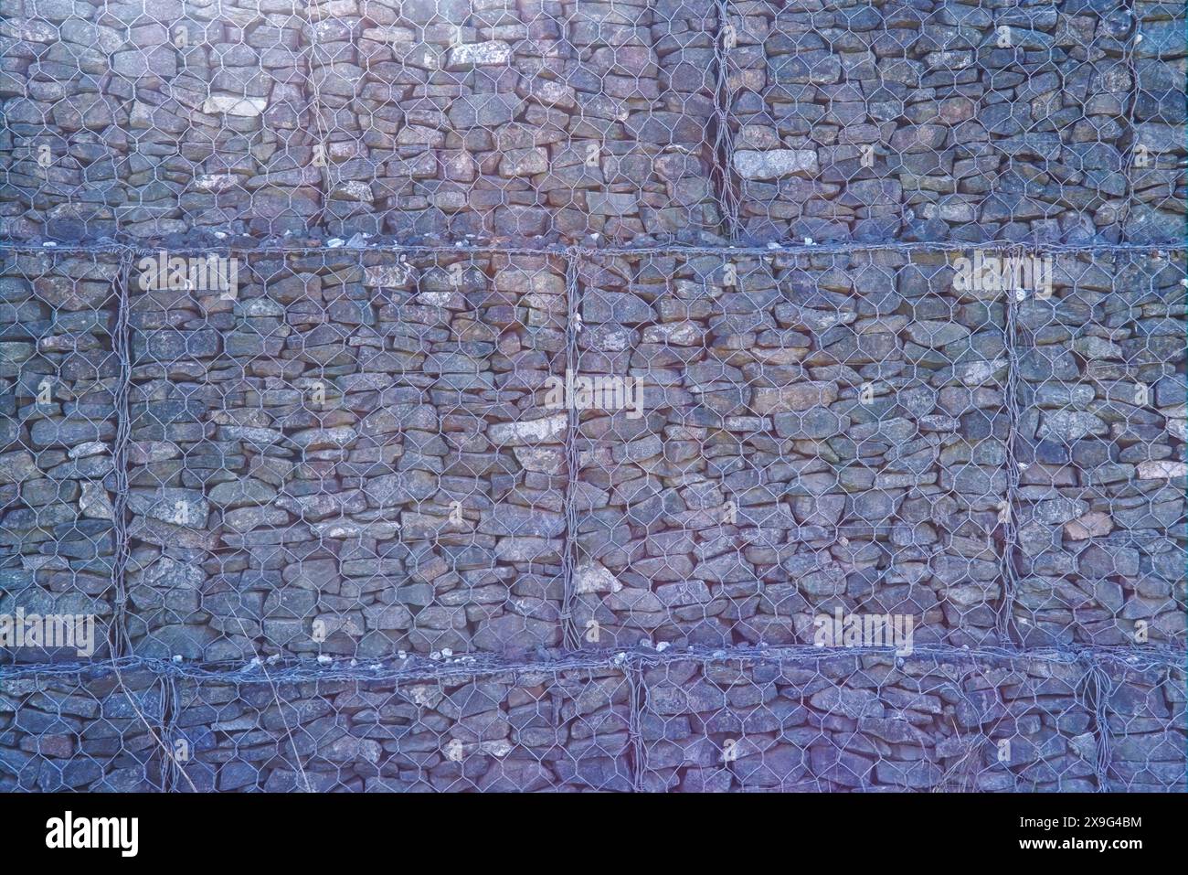 Gabion fence wall from steel mesh with stones. Gabion wire mesh fencing ...