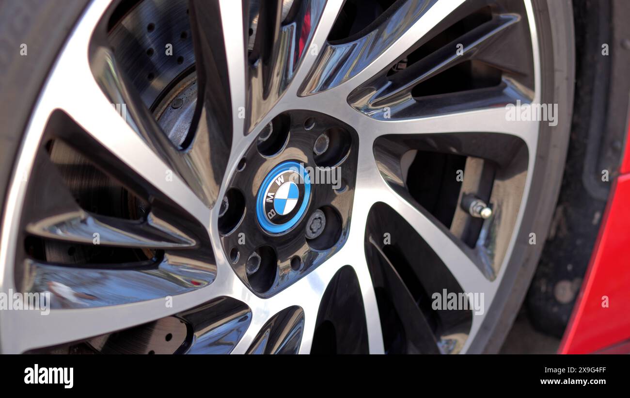 An alloy wheel of BMW with company logo Stock Photo - Alamy
