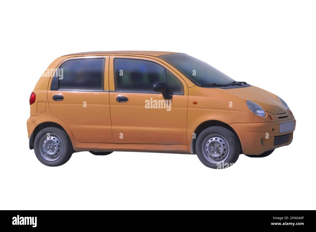 Compact orange passenger car isolated on a white background close-up ...