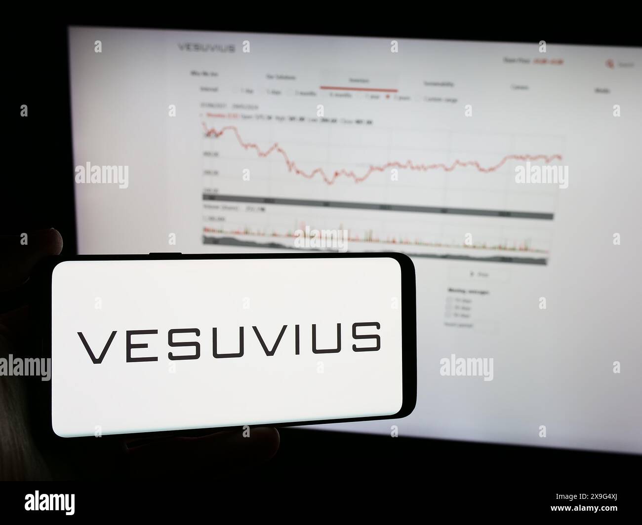 Person holding mobile phone with logo of British engineered ceramics ...