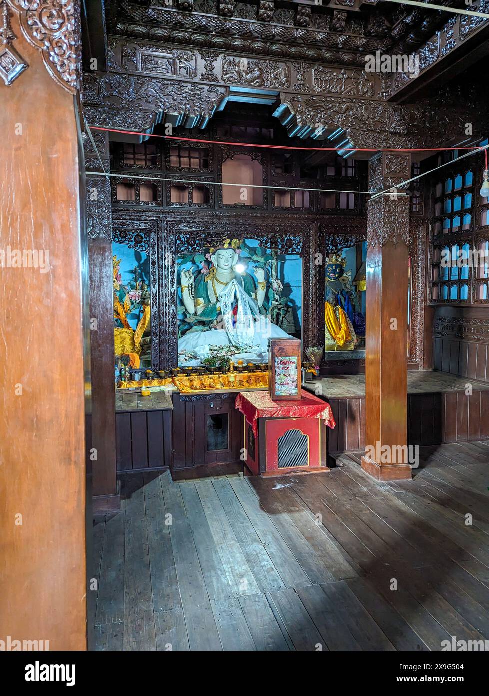 Buddha Statue, Fire Temple at Muktinath, Mustang, Nepal Stock Photo - Alamy