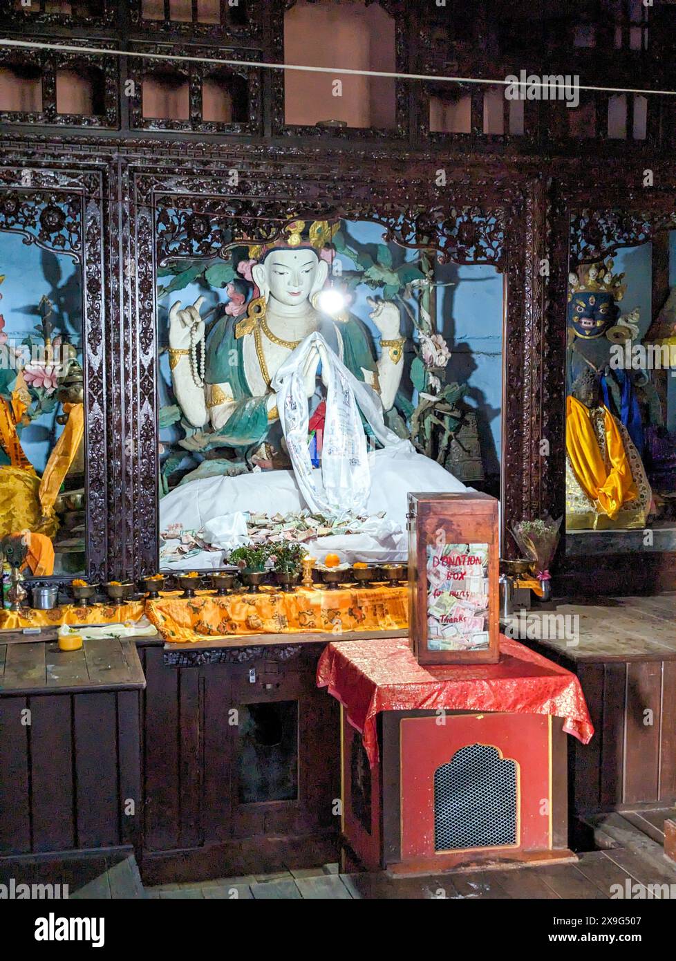 Buddha Statue, Fire Temple at Muktinath, Mustang, Nepal Stock Photo - Alamy