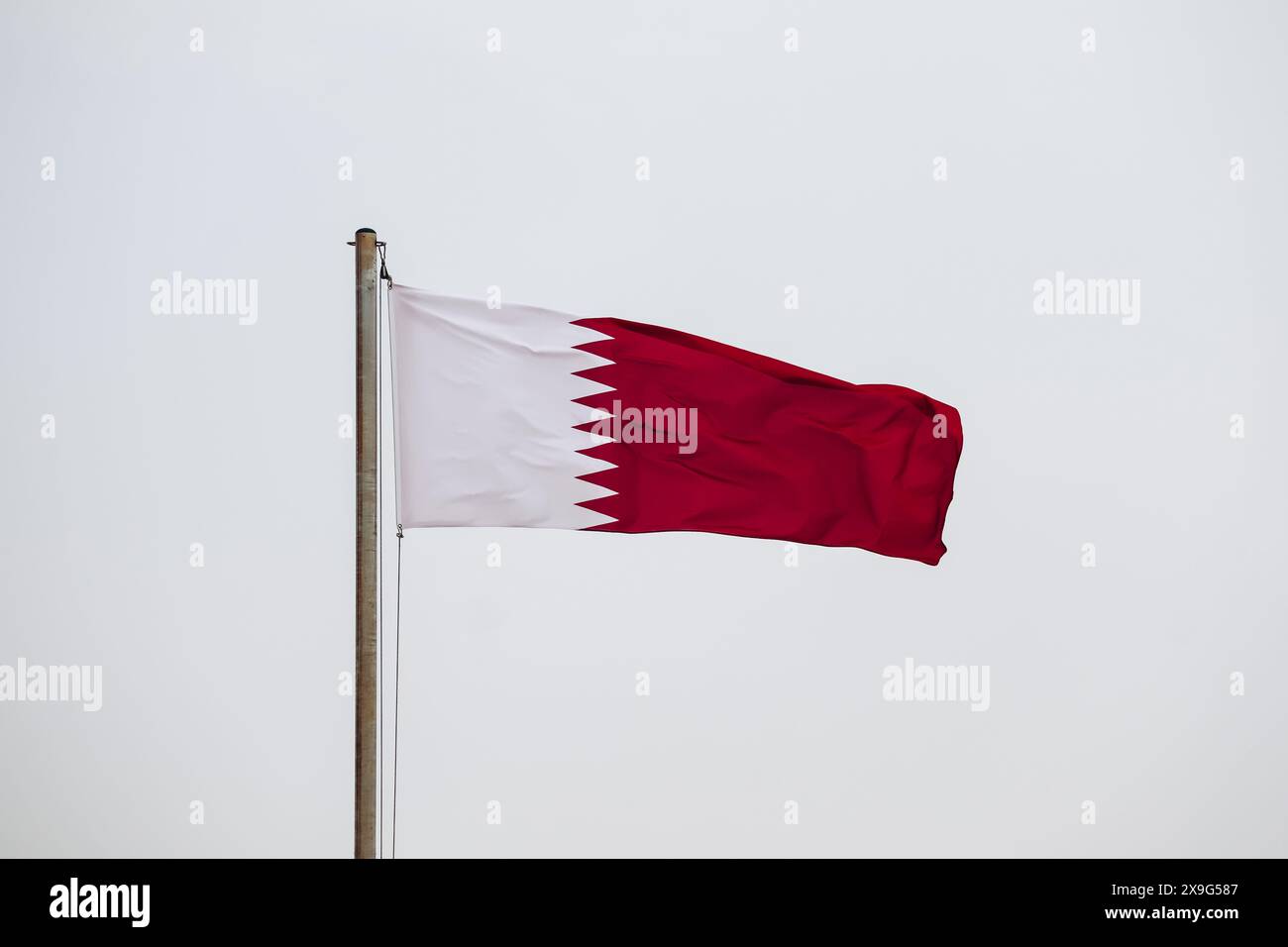 Waving flag of Qatar, in Doha Stock Photo - Alamy
