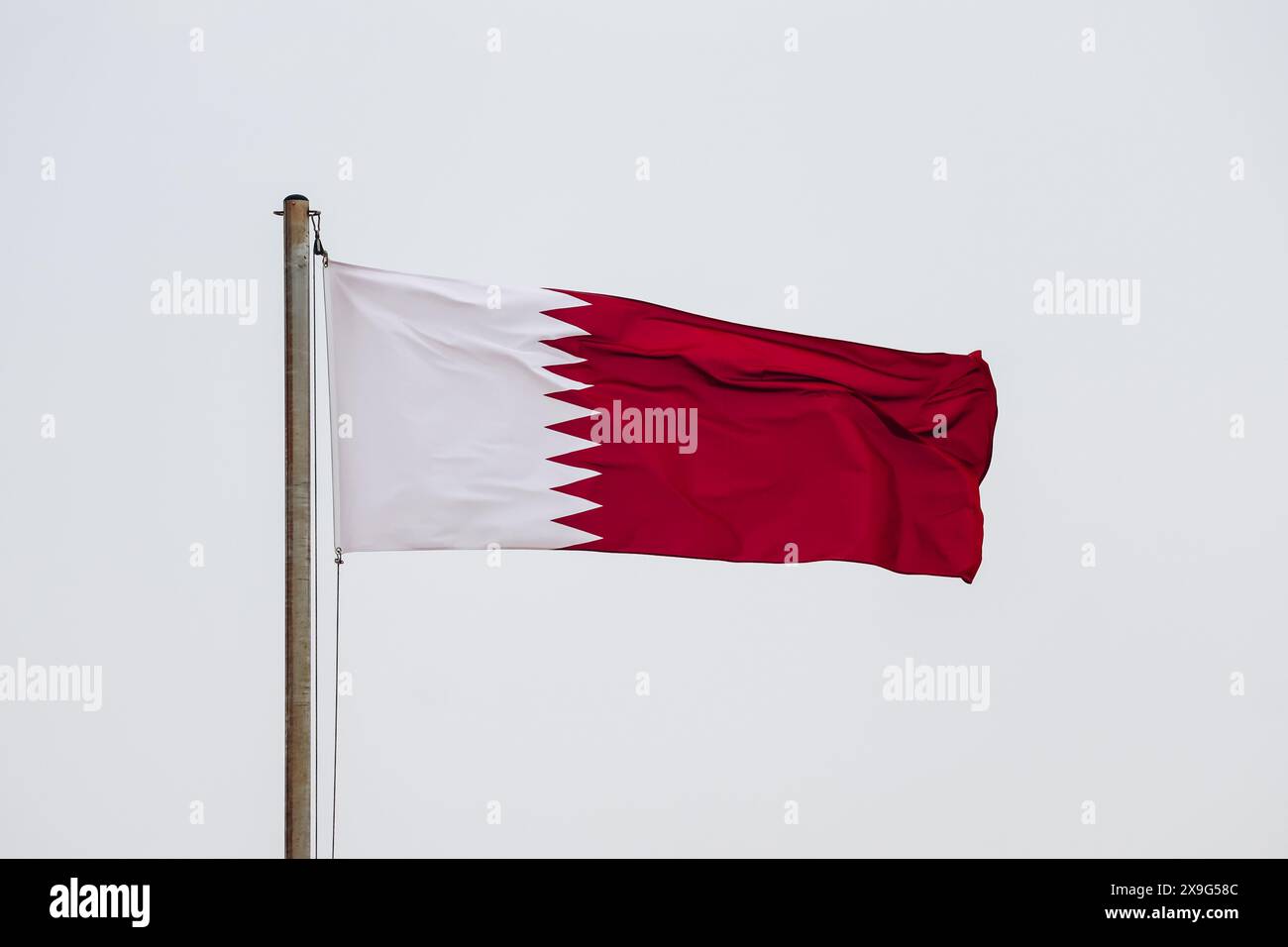 Waving flag of Qatar, in Doha Stock Photo - Alamy