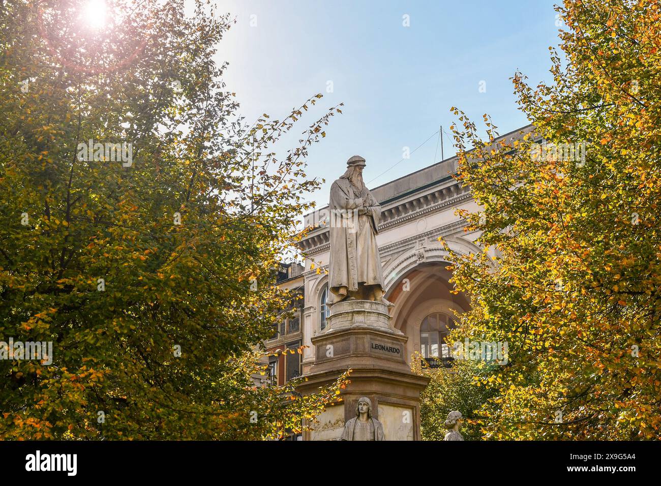 Backlight view with lens flares of the monument to Leonardo da Vinci ...