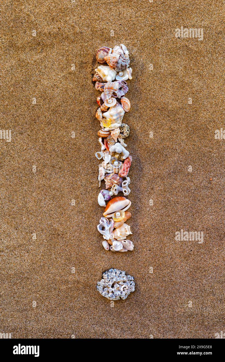 Question mark made sand background hi-res stock photography and images ...