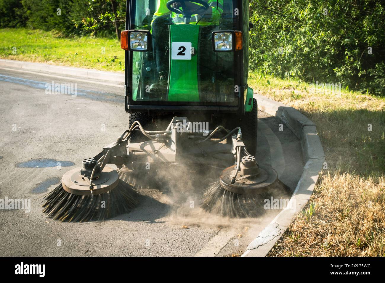 Street Sweeper With Rotating Brushes Cleaning Asphalt Pavement Stock ...