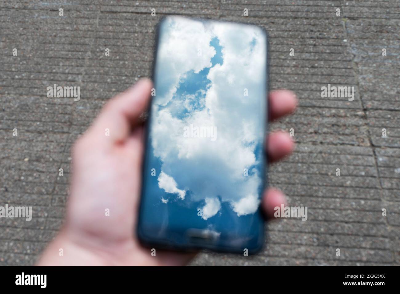 Data cloud reflection on mobile phone screen from the sky. Technology ...