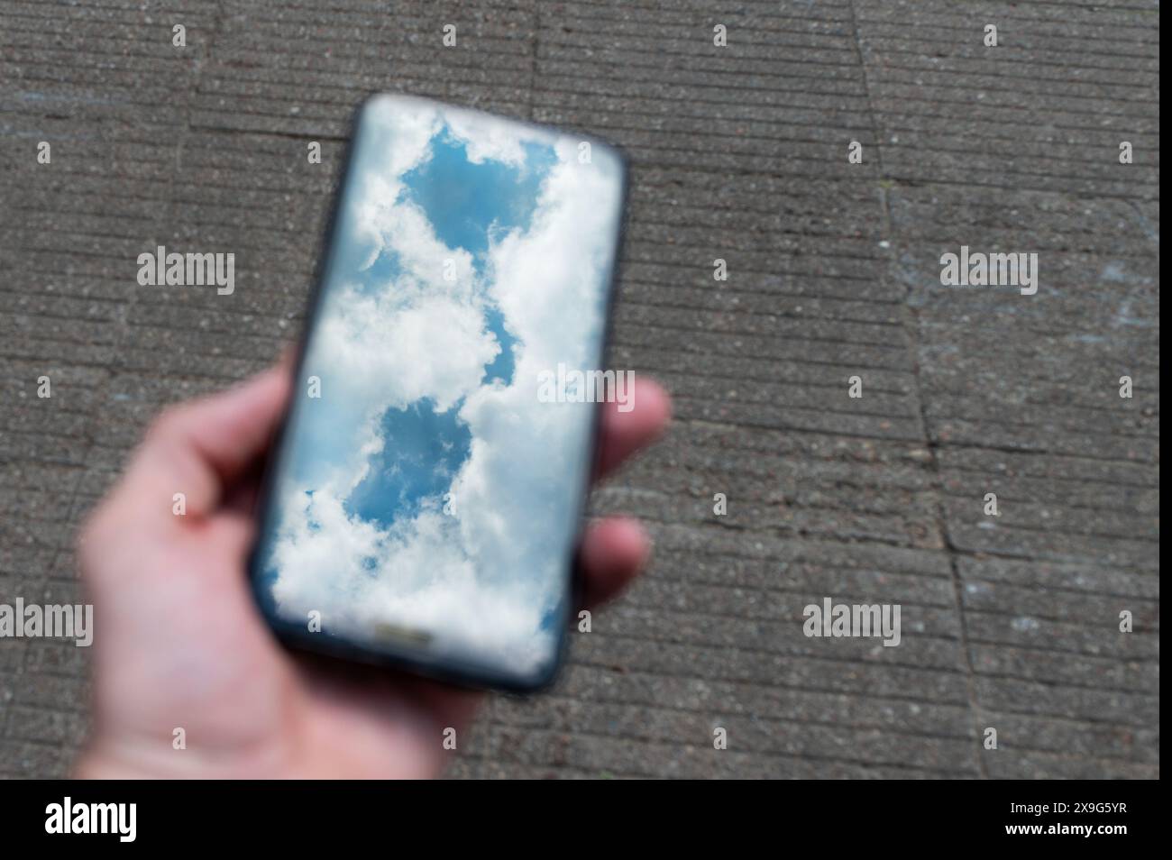 Data cloud reflection on mobile phone screen from the sky. Technology ...