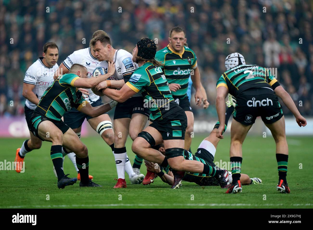 Saracen's Nick Tompkins is tackled by Northampton Saints' Ollie ...