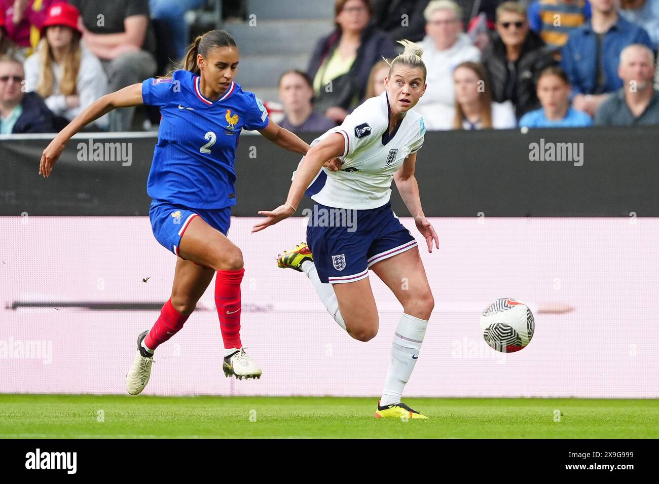 England's Alessia Russo (right) and France's Maelle Lakrar battle for ...