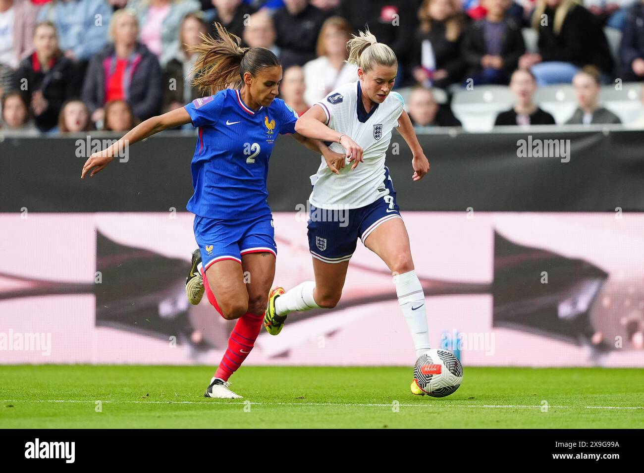 England's Alessia Russo (right) and France's Maelle Lakrar battle for ...