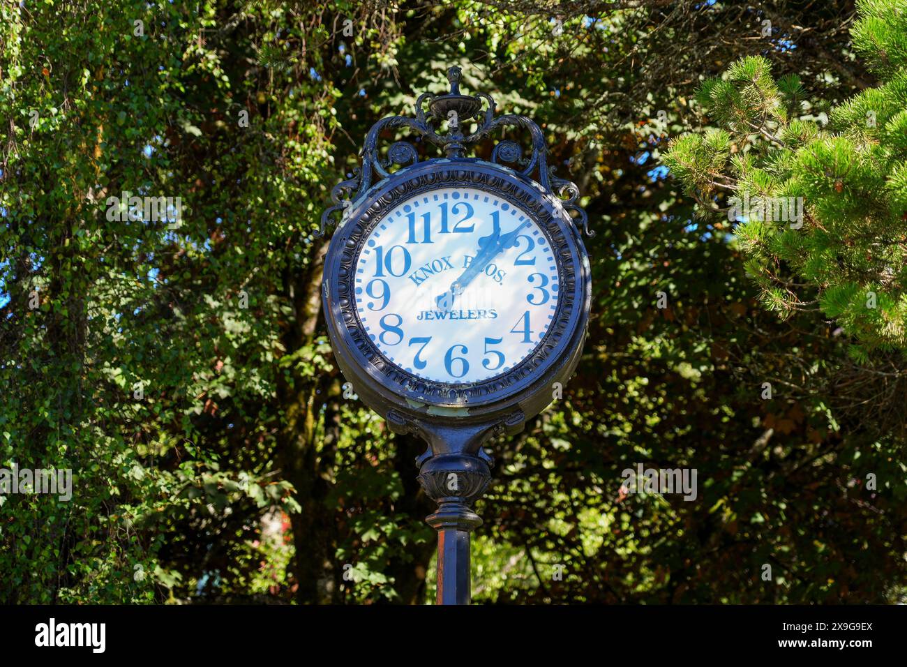 Vintage clock on a pole in downtown Ketchikan, Alaska Stock Photo - Alamy