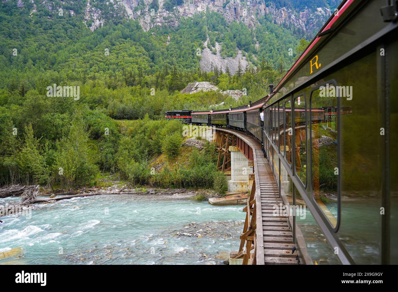 Narrow-gauge train of the White Pass and Yukon Route on an old trestles ...