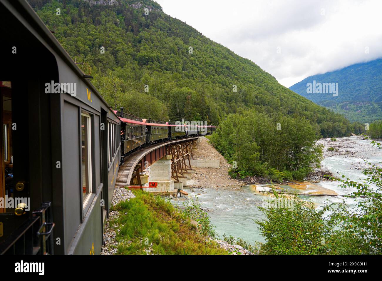 Narrow-gauge train of the White Pass and Yukon Route on an old trestles ...
