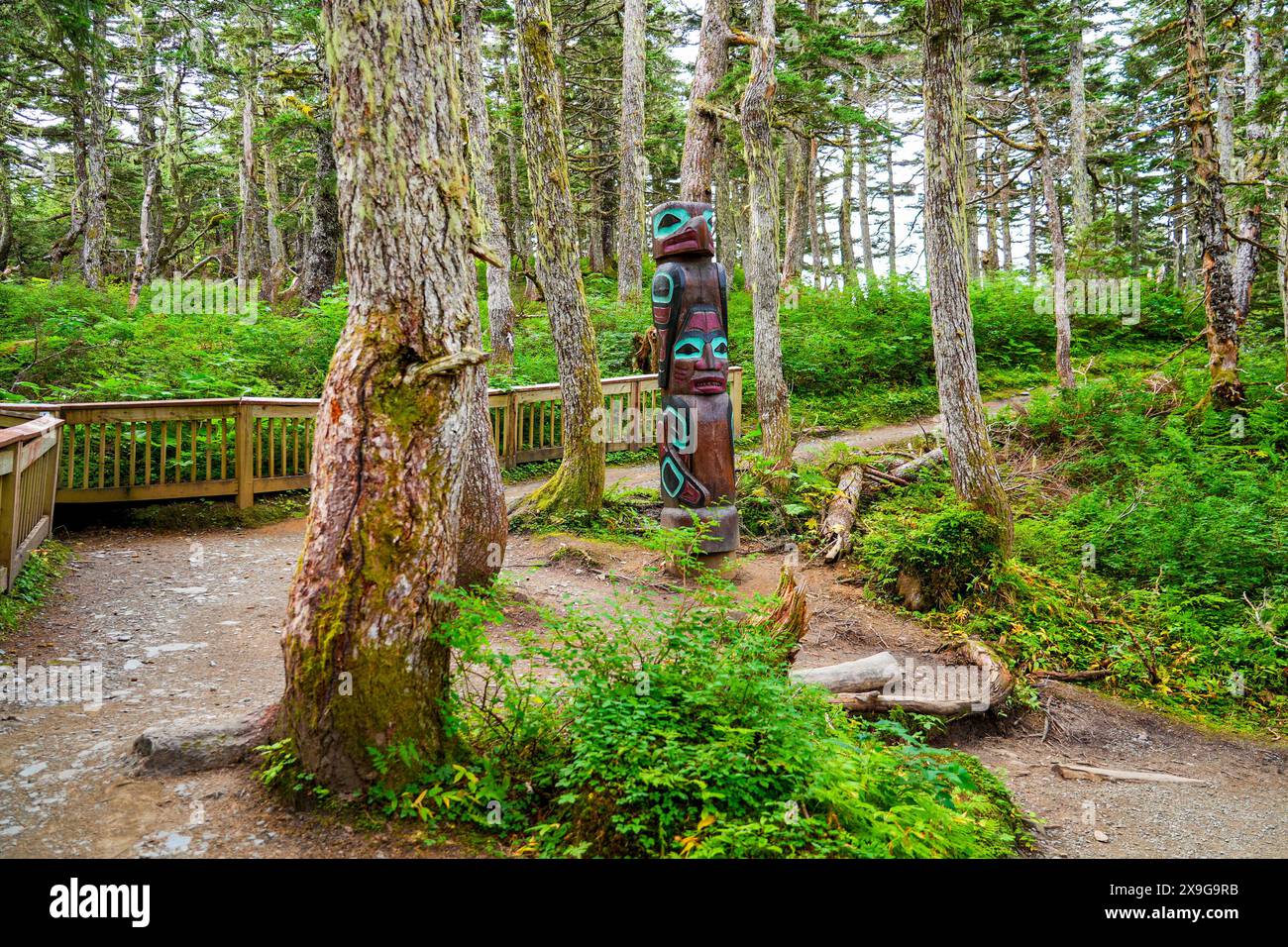 Native American totem pole in a forest on top of Mount Roberts above ...