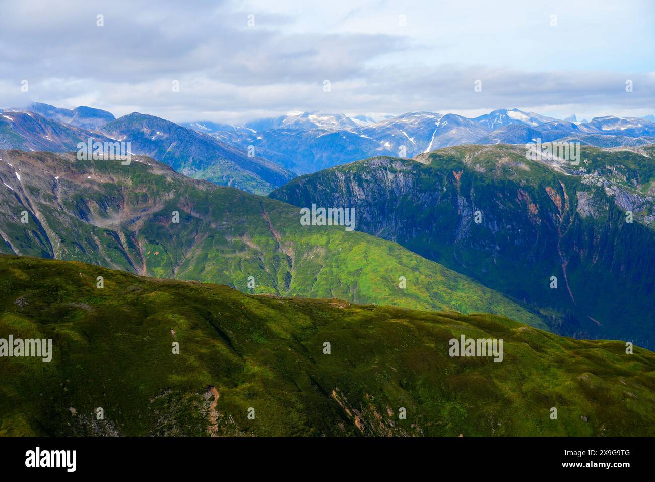 Aerial view of the snow-capped mountain summits east of Juneau, Alaska ...