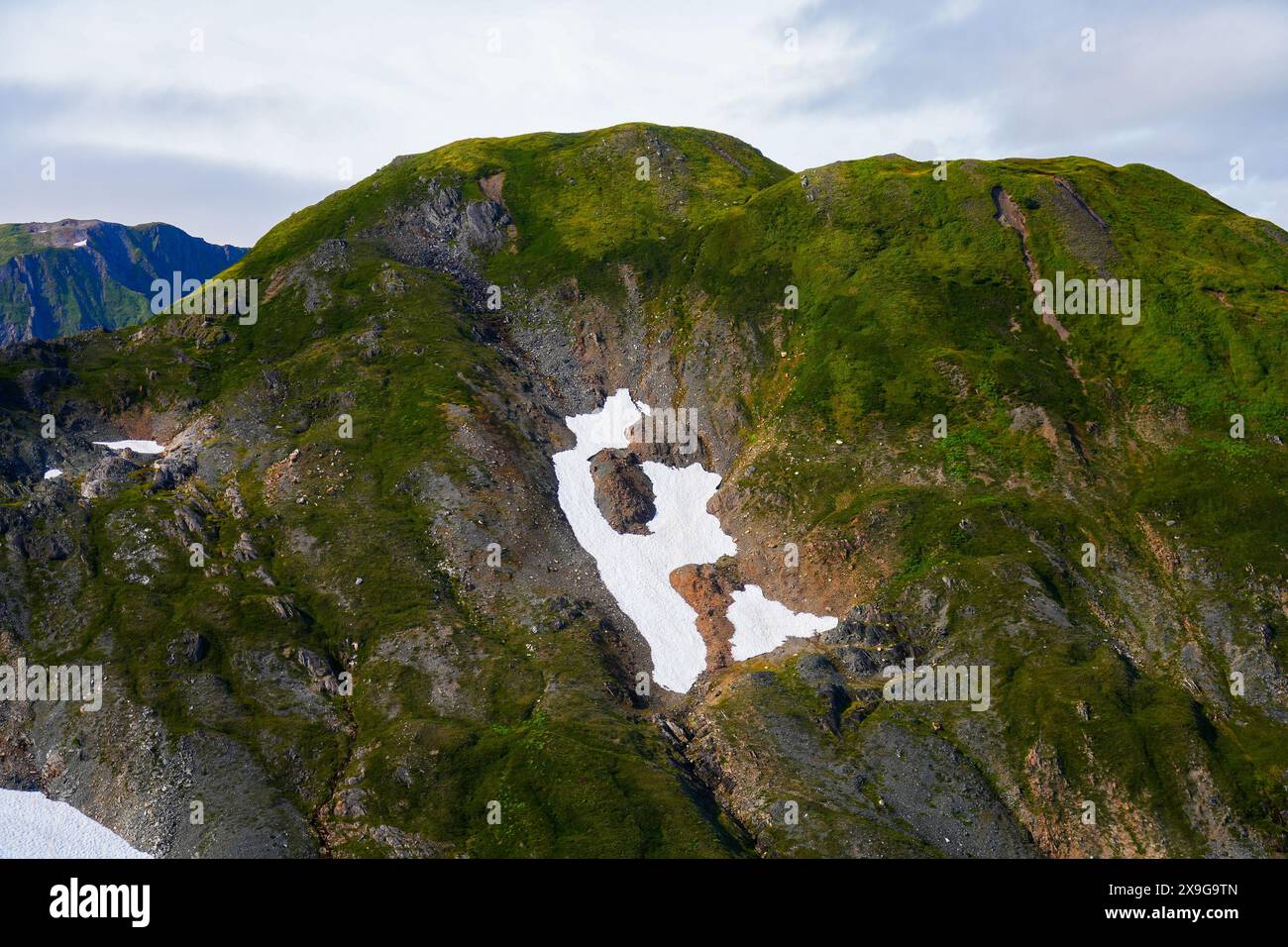 Aerial view of the snow-capped mountain summits east of Juneau, Alaska ...